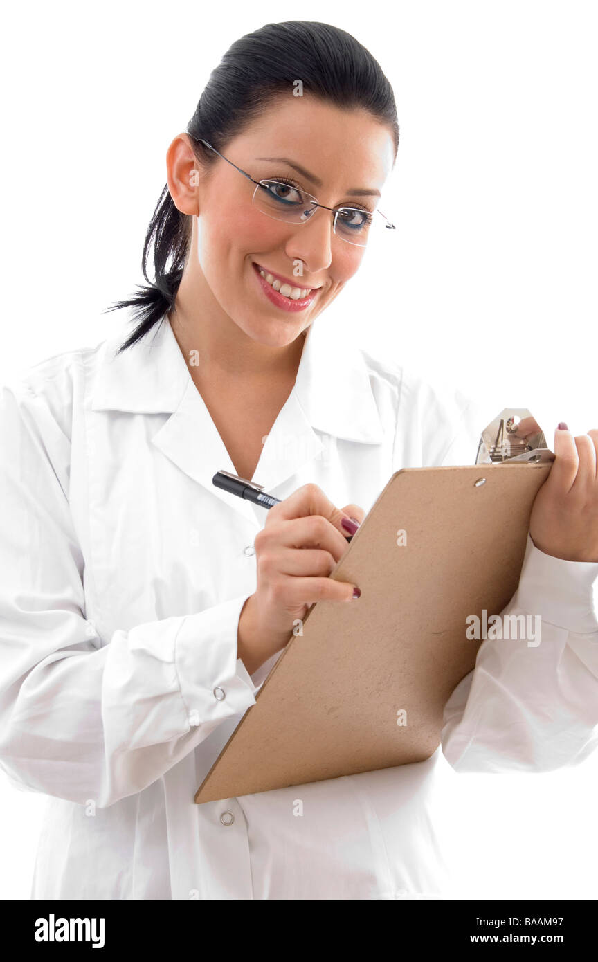 front view of smiling doctor with writing pad Stock Photo - Alamy
