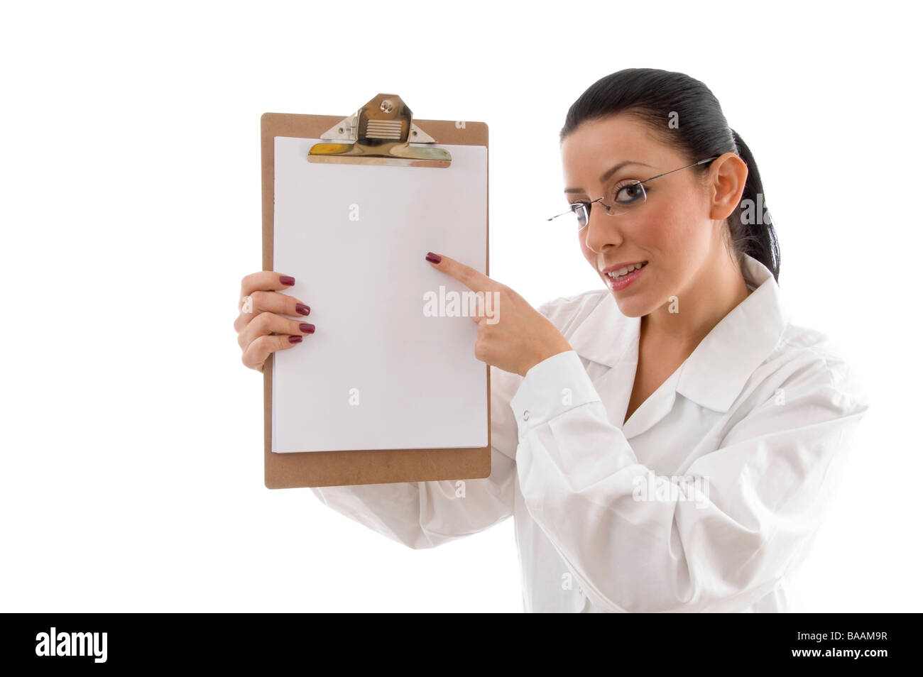 portrait of female doctor pointing writing pad Stock Photo - Alamy