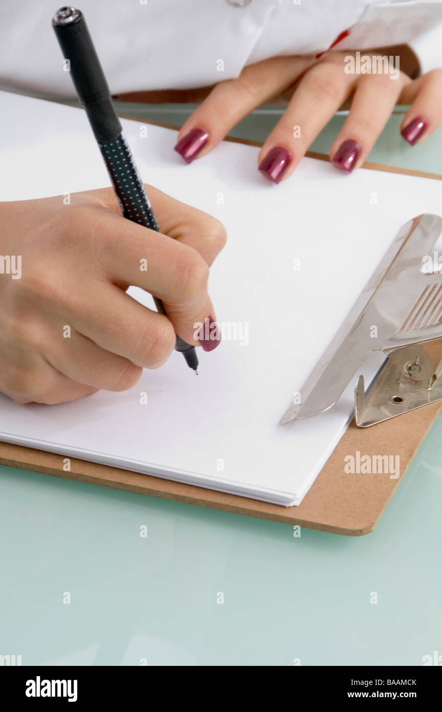 writing hands with notepad Stock Photo - Alamy