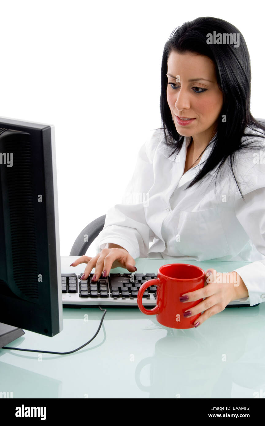 front view of working woman holding mug against white background Stock ...