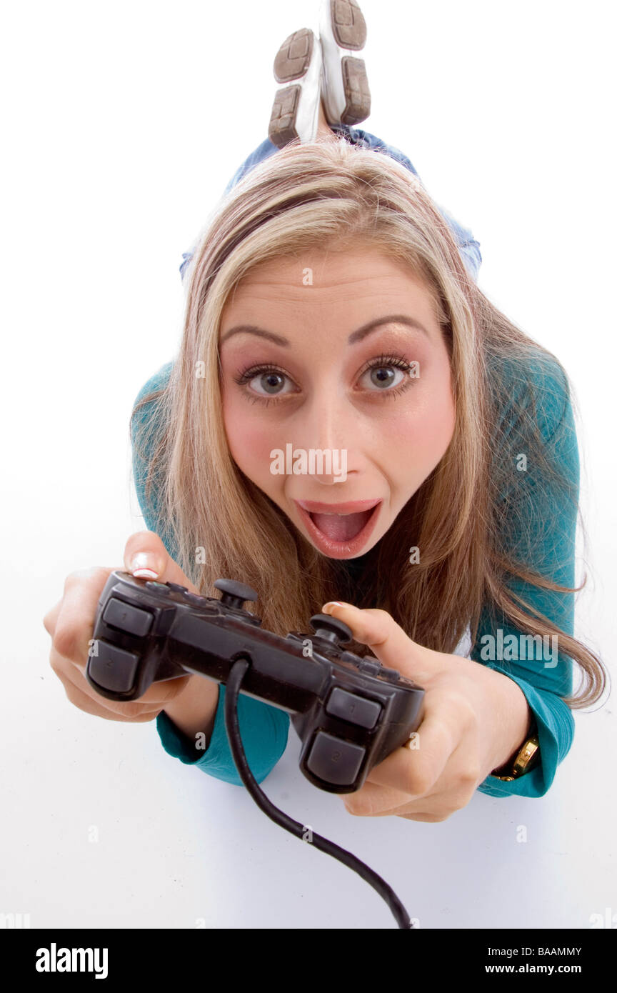 surprised woman holding remote control Stock Photo - Alamy