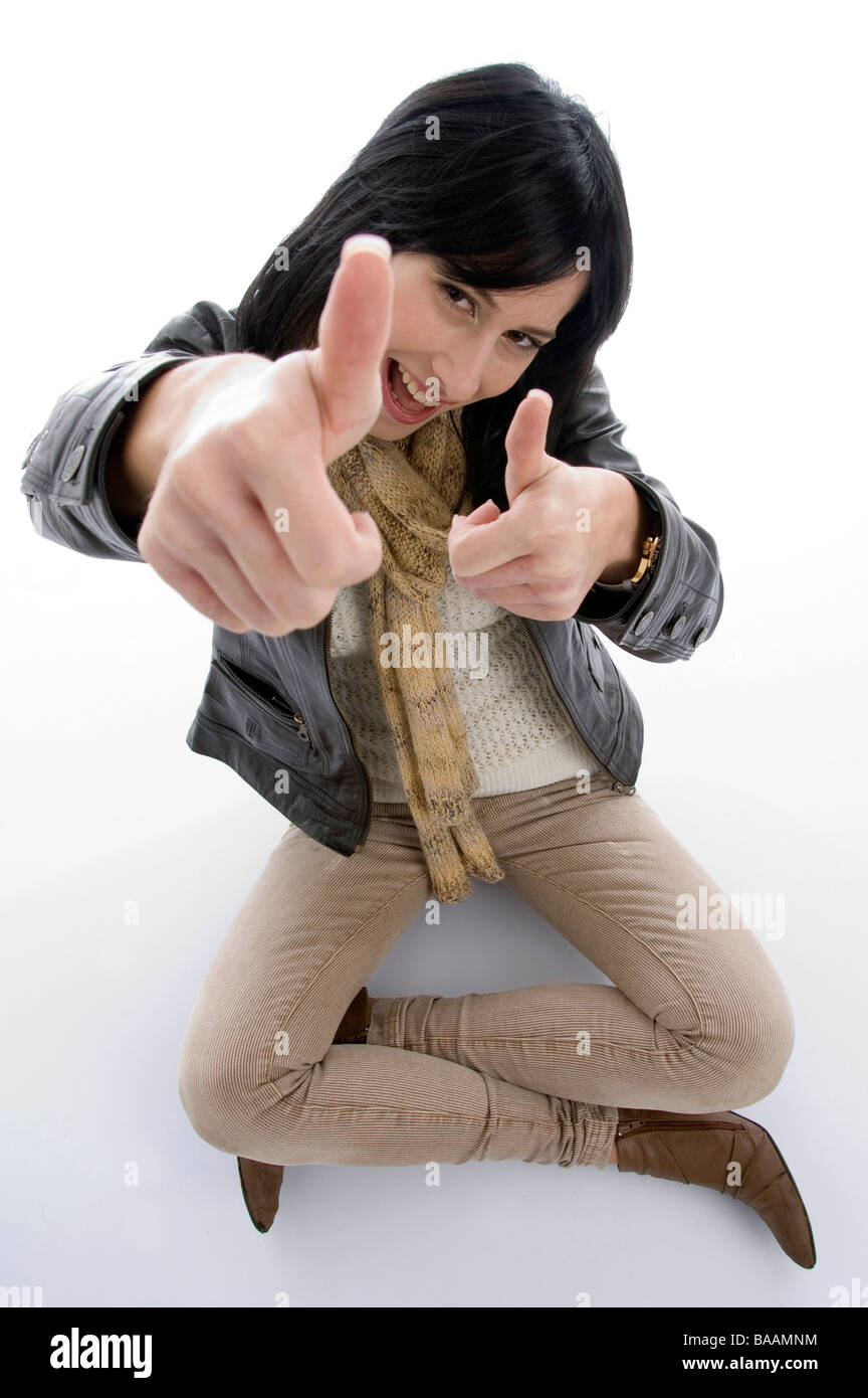 sitting woman showing approval sign Stock Photo - Alamy