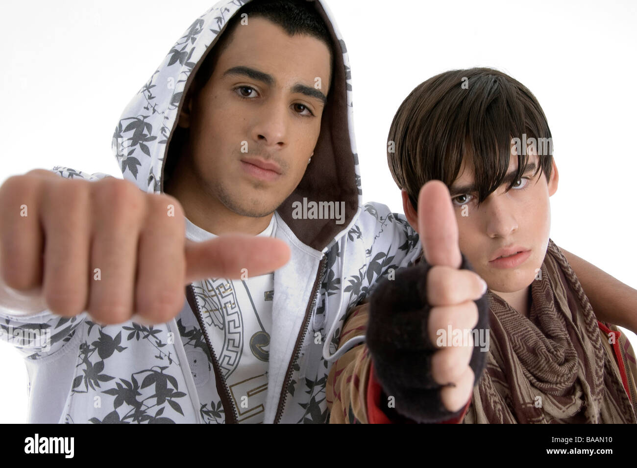 young friends showing thumbs up Stock Photo - Alamy
