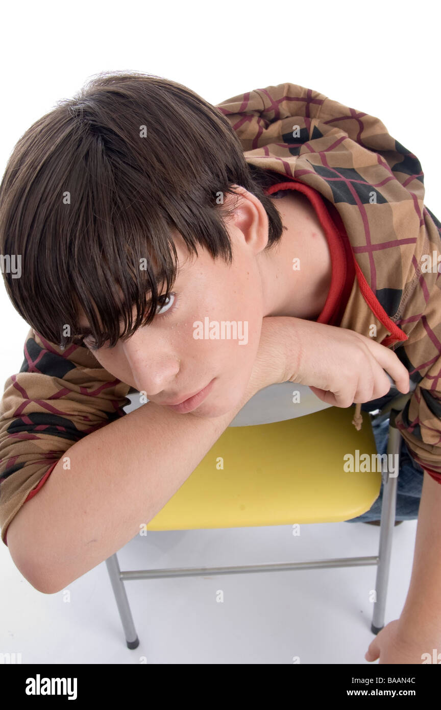 boy sitting on the chair Stock Photo - Alamy
