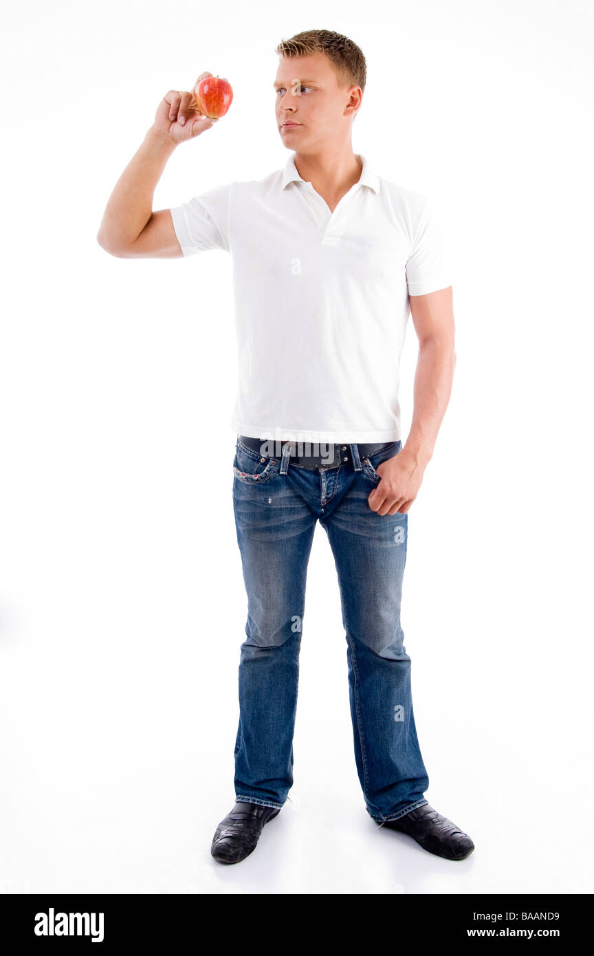 standing male looking at apple Stock Photo - Alamy