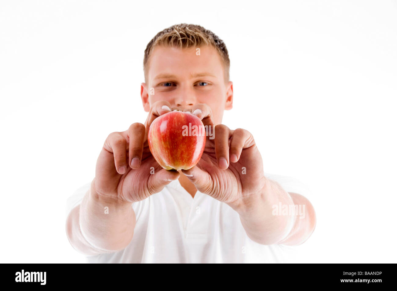 male holding apple with both hands Stock Photo - Alamy