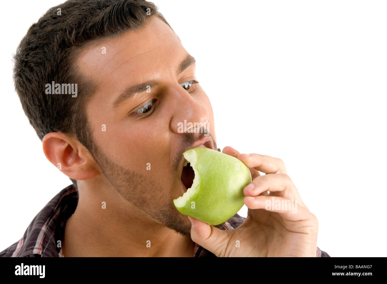 man eating green apple Stock Photo - Alamy