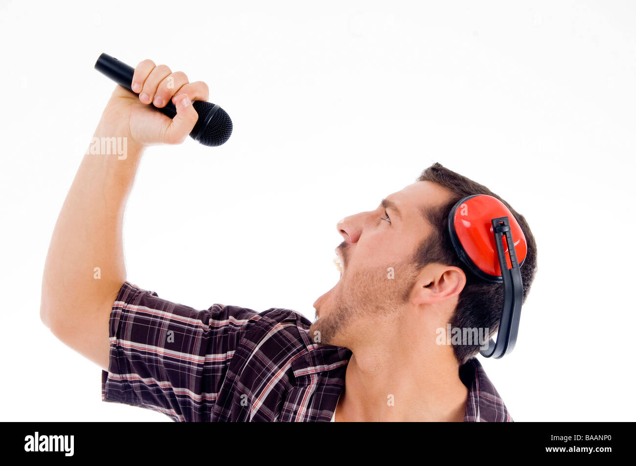 male singing loudly on microphone Stock Photo - Alamy