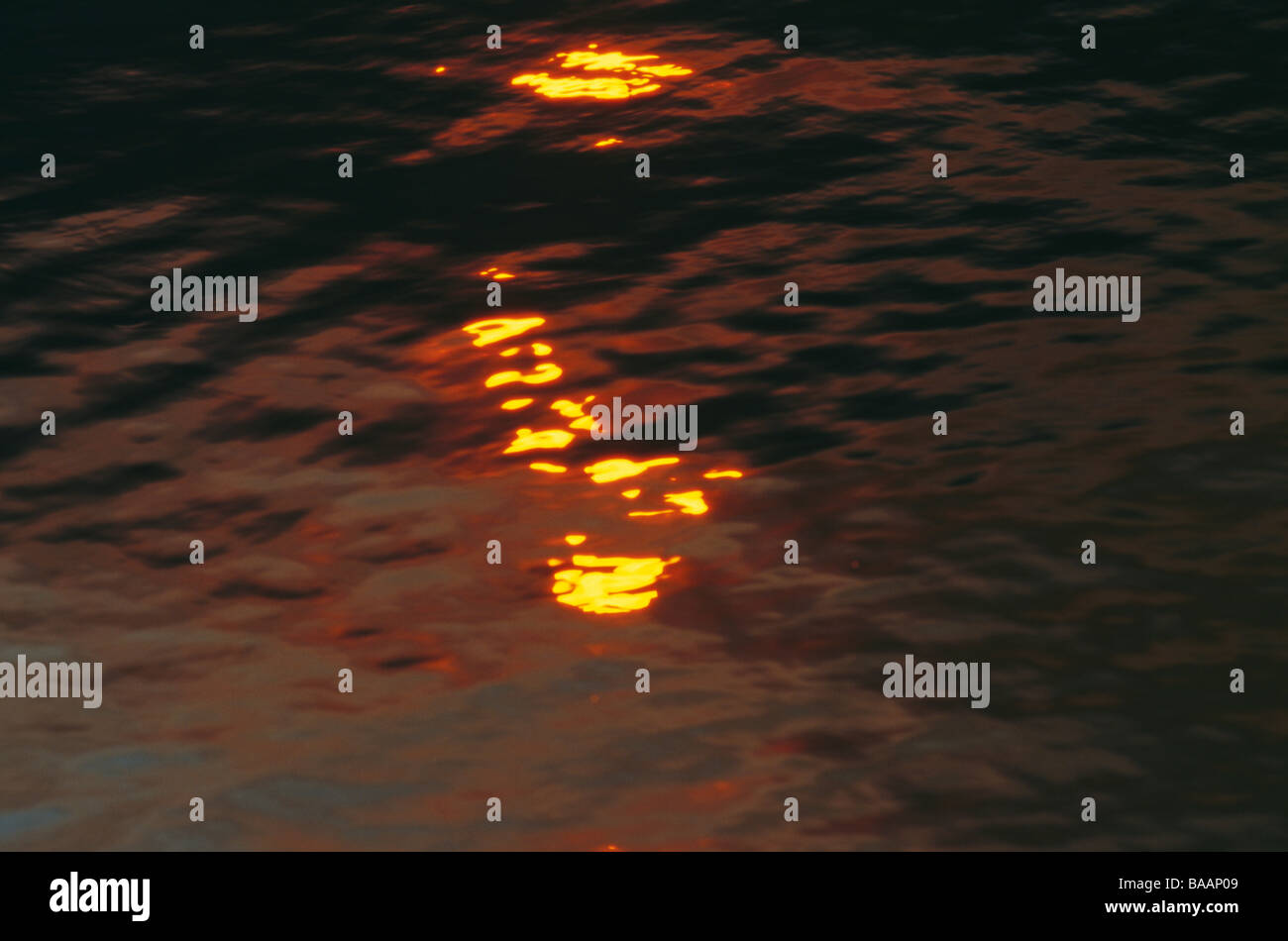 Sunlight reflection on sea water at night Stock Photo - Alamy