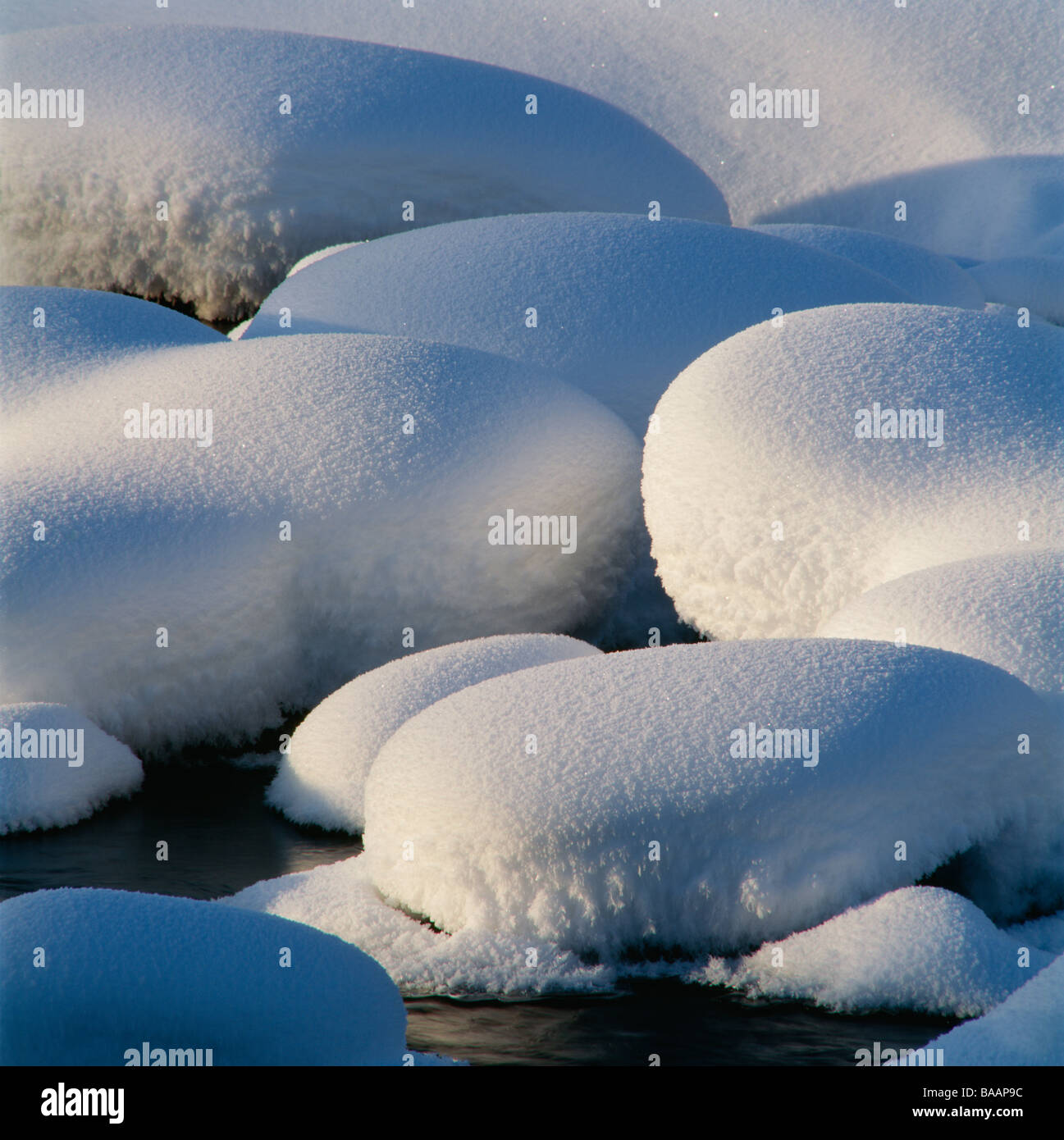 Rocks covered with snow Stock Photo - Alamy