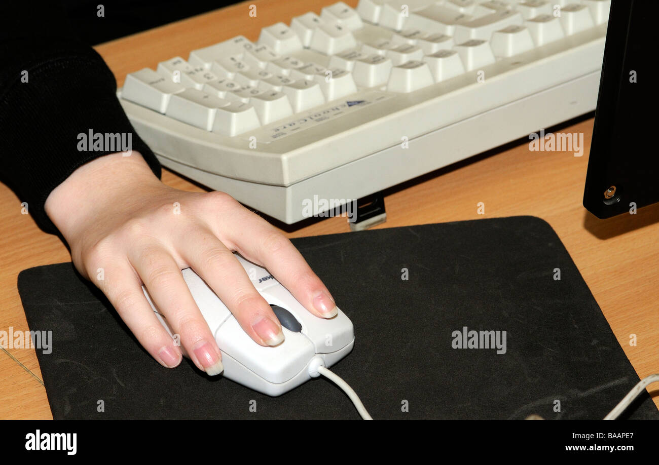 Female hand using a computer mouse Stock Photo - Alamy