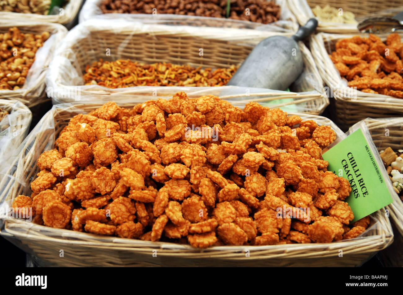 Chilli flavoured rice crackers in a basket Stock Photo - Alamy