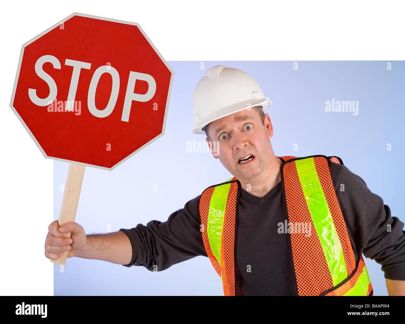 Road worker holding stop sign hi-res stock photography and images - Alamy