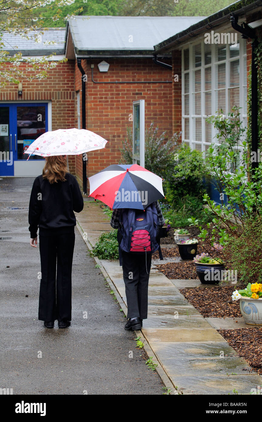 Children walking to school in the rain Stock Photo - Alamy