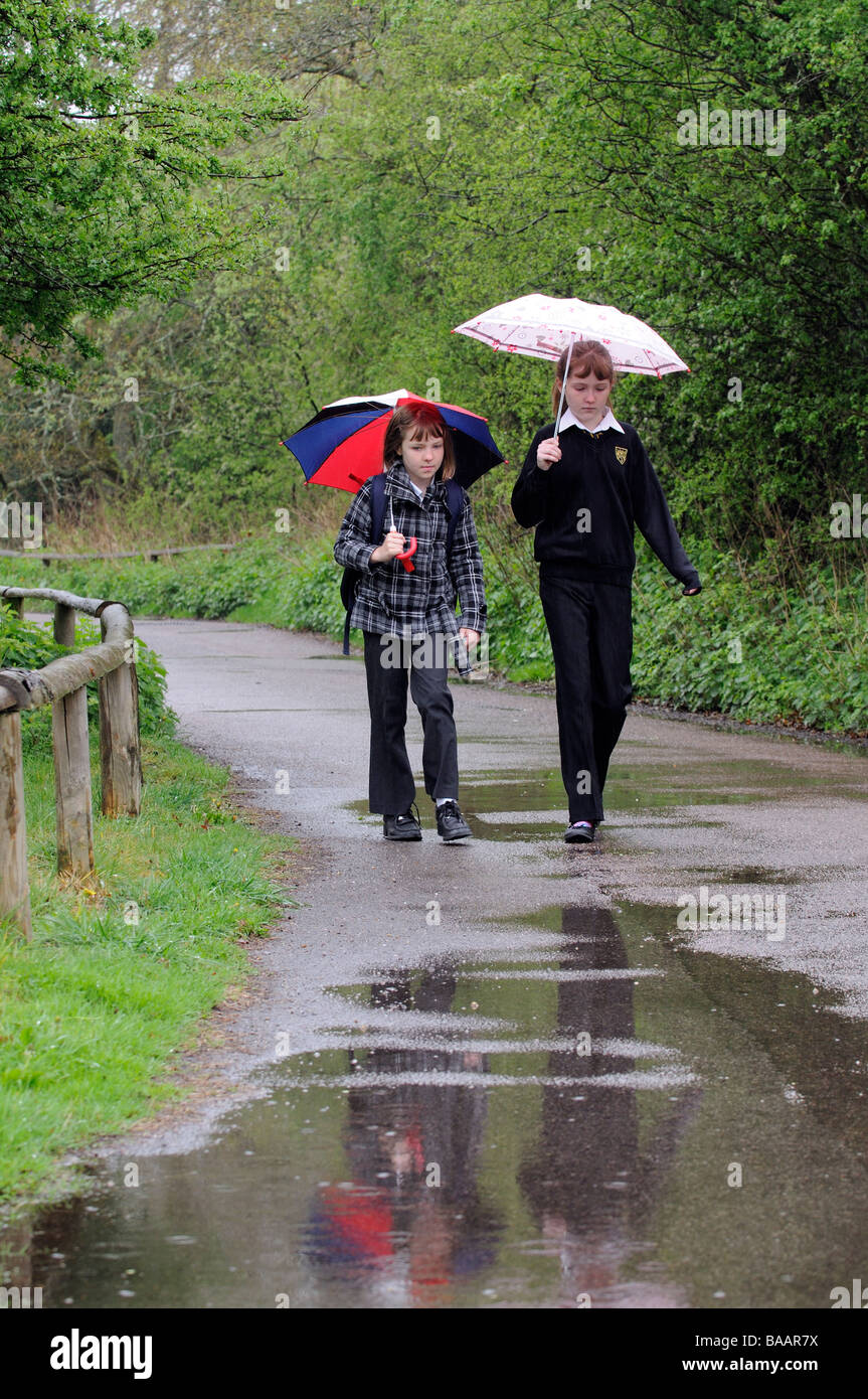 Children walking to school in the rain Stock Photo - Alamy