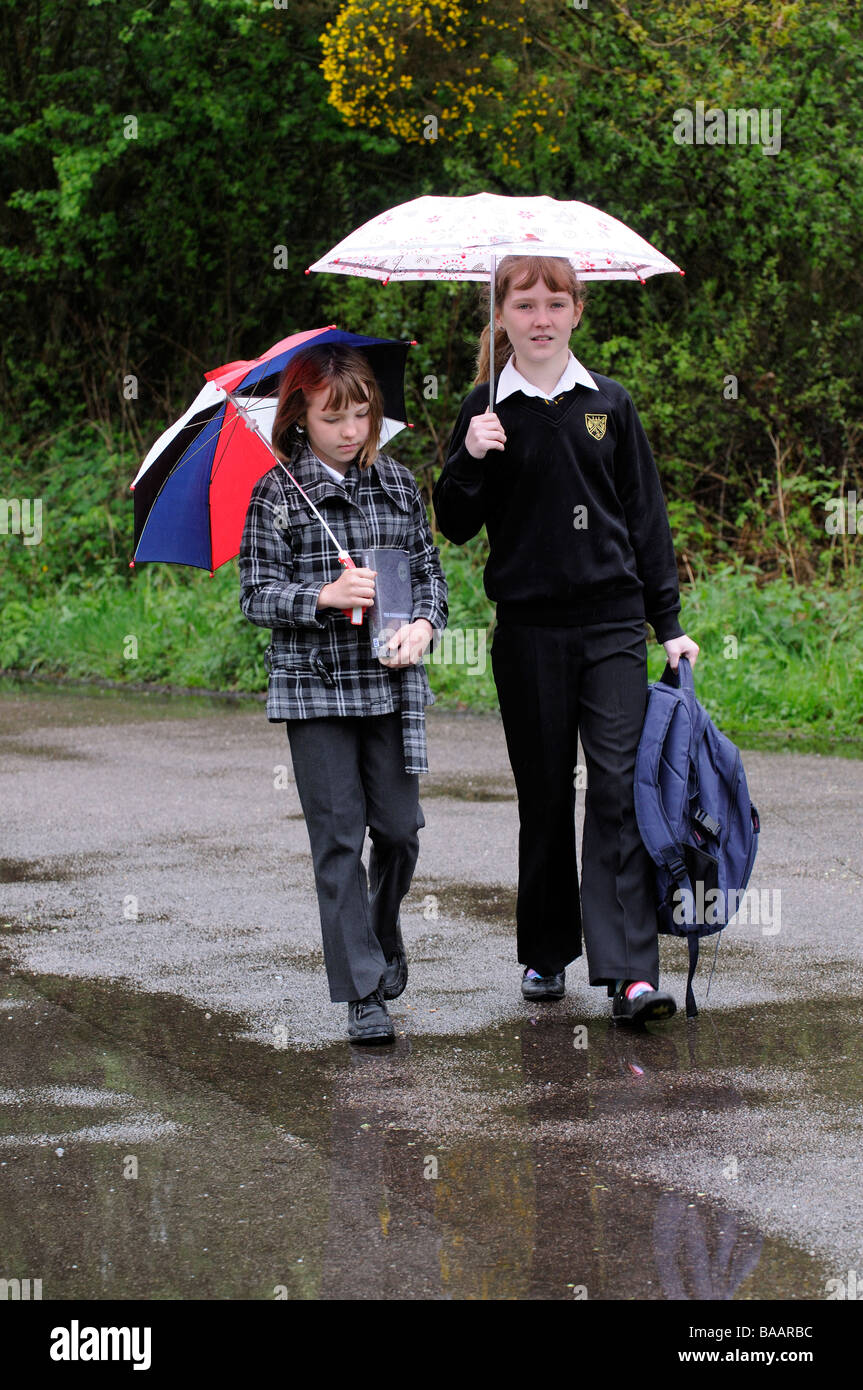 Children walking to school in the rain Stock Photo - Alamy