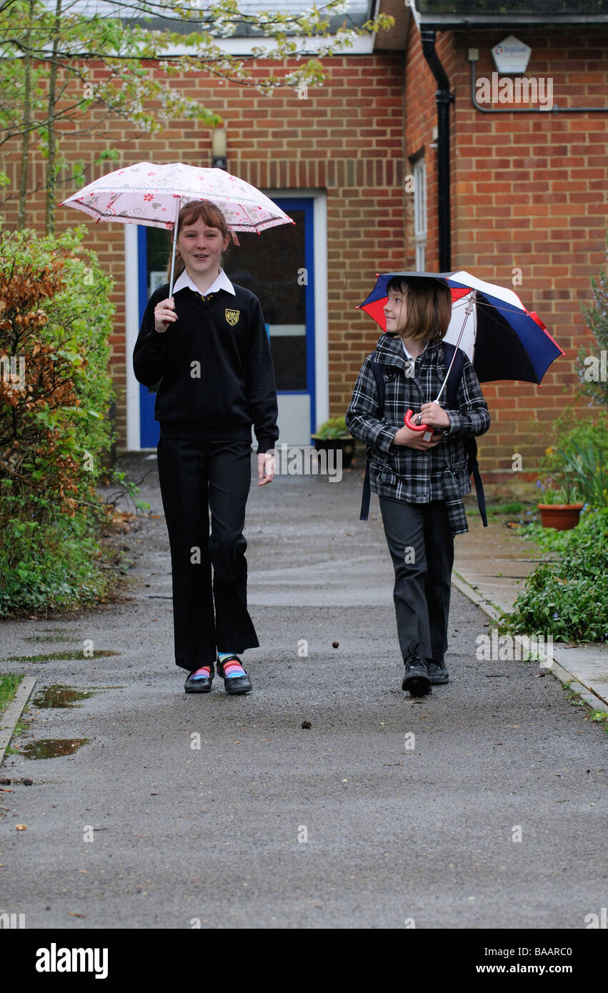 Students walk home in rain hi-res stock photography and images - Alamy