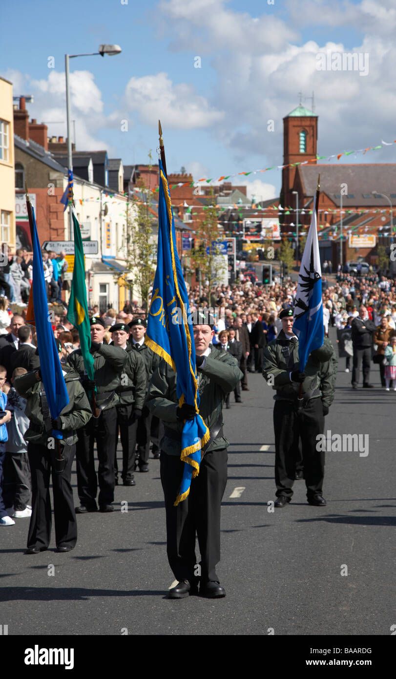 flag bearing colour party march along the falls road on Easter Sunday ...