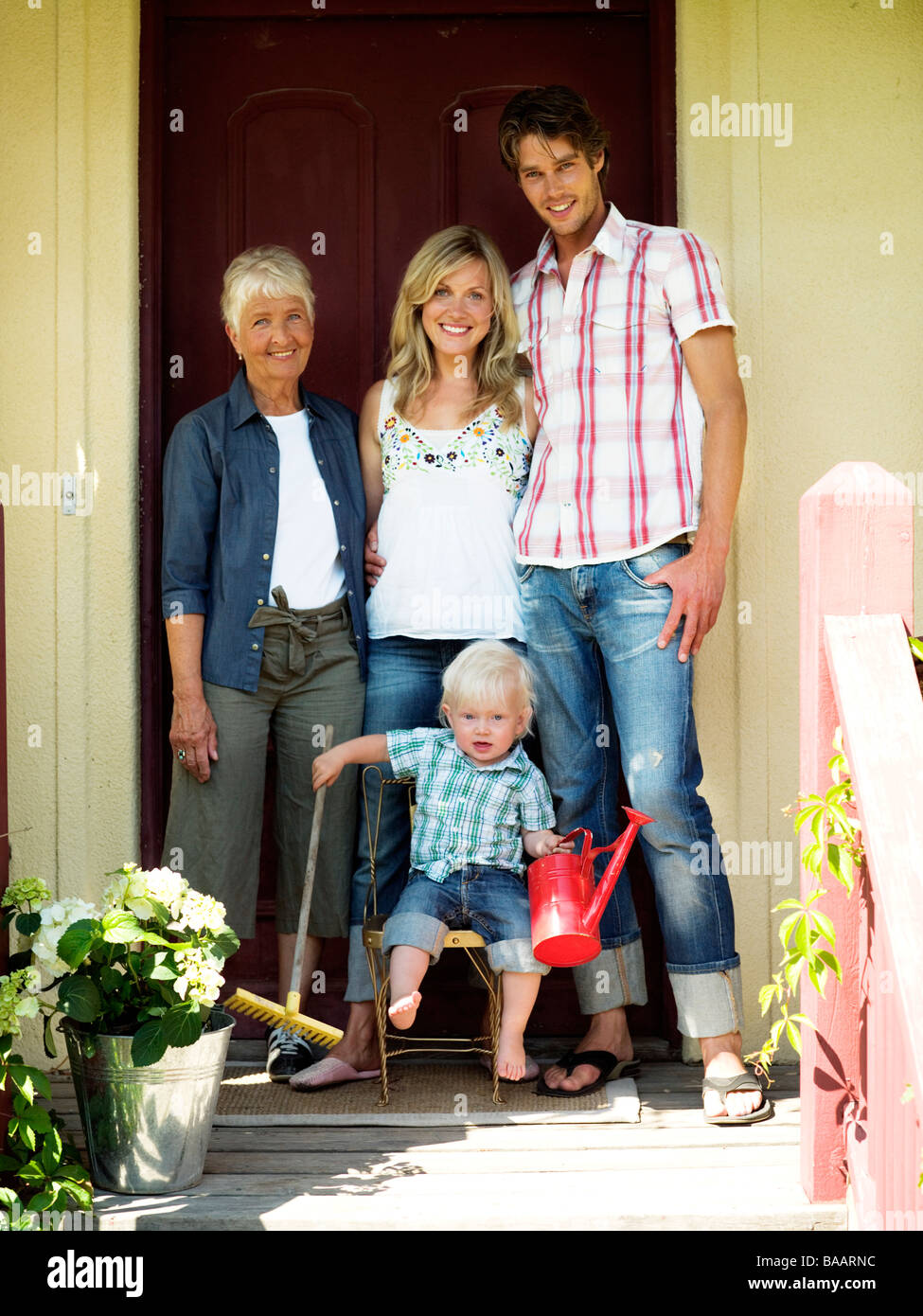 Family standing in front of house hi-res stock photography and images ...