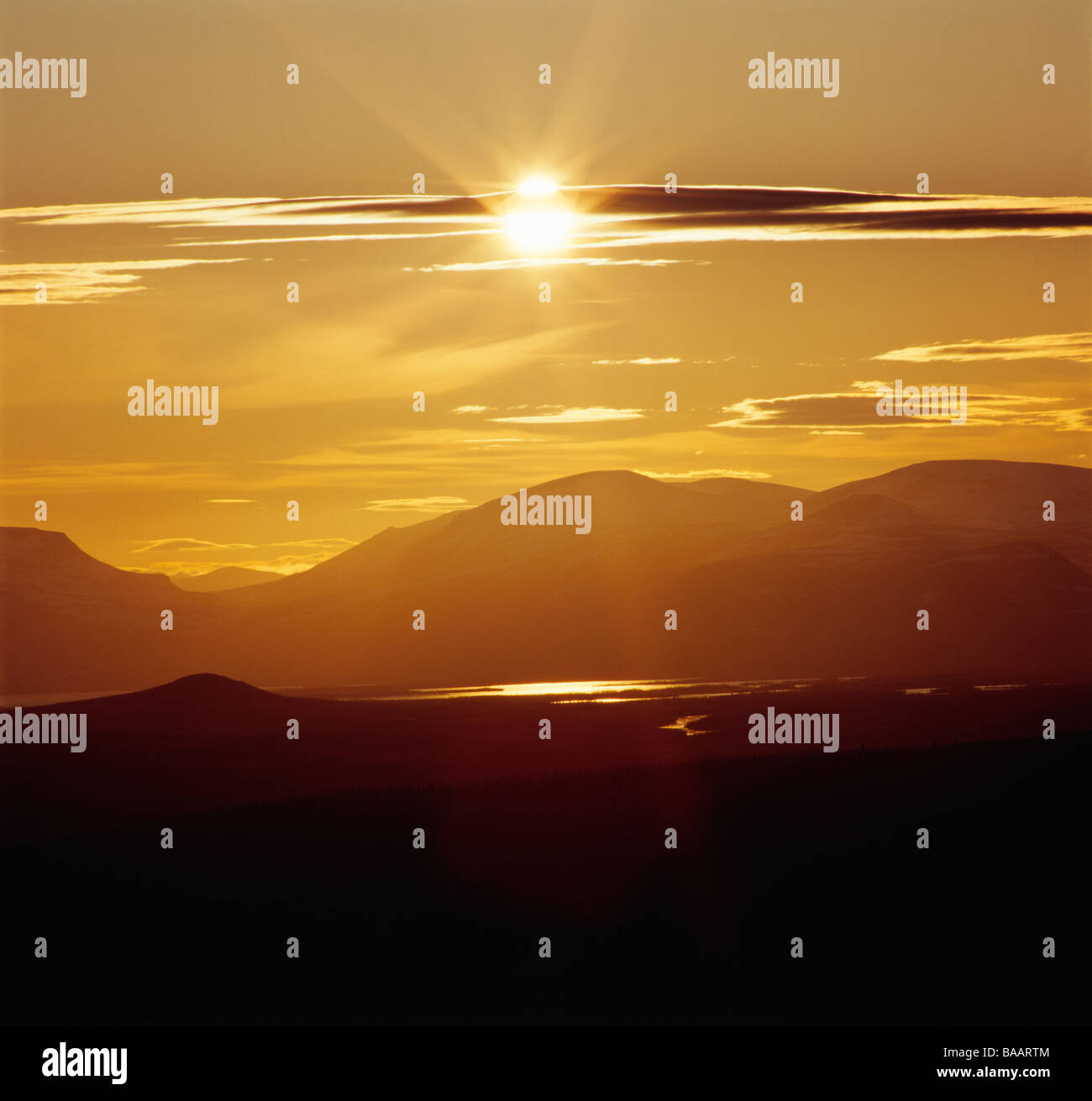 Silhouette of mountains at dusk Stock Photo - Alamy