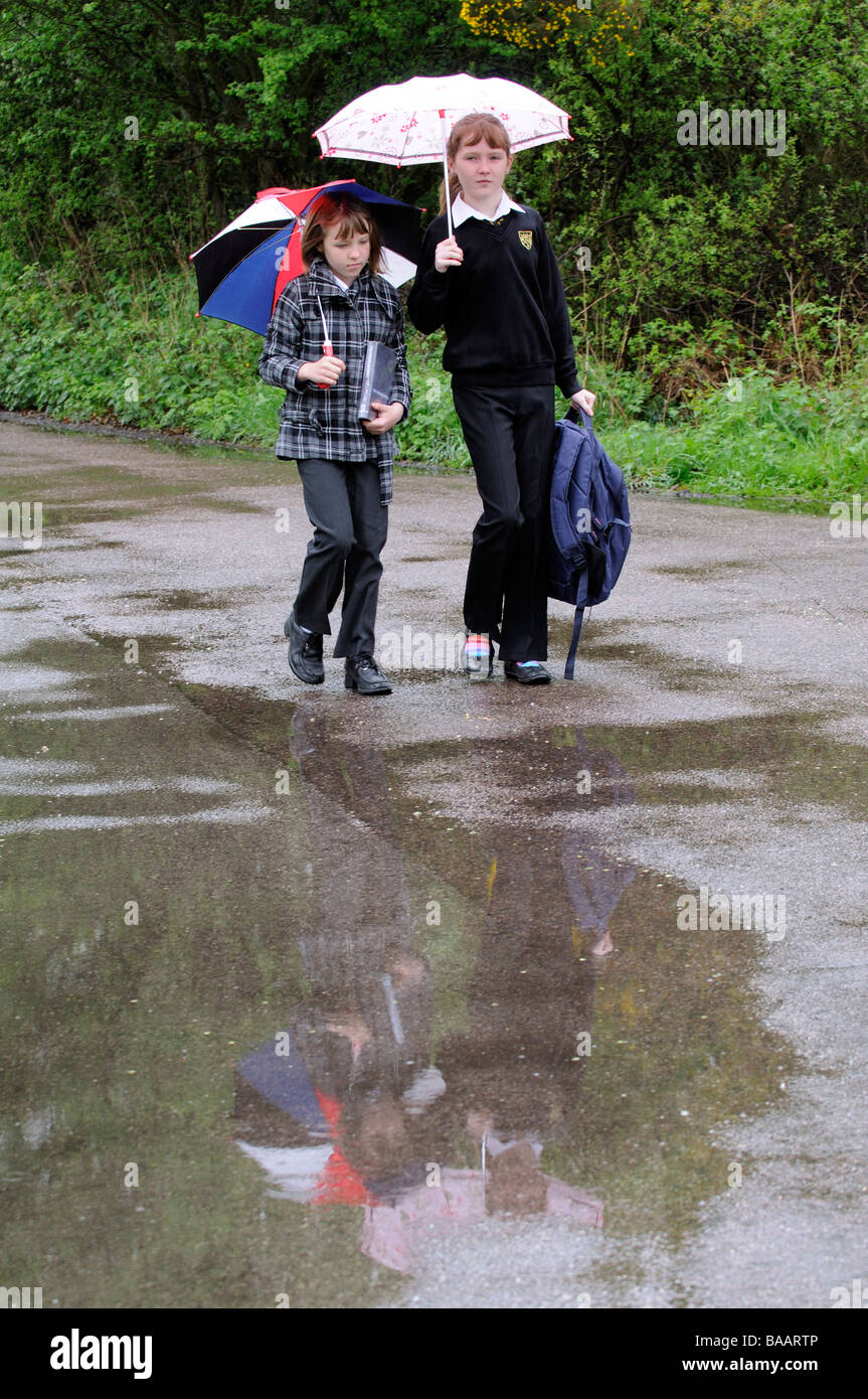 Children walking to school in the rain Stock Photo - Alamy