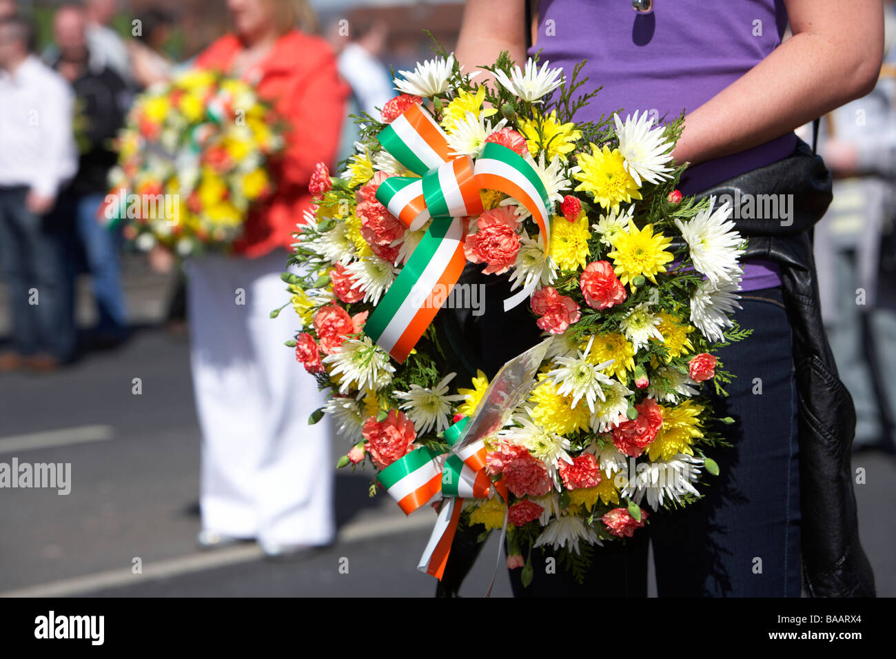 women carry floral wreaths commemorating irish dead easter Sunday ...