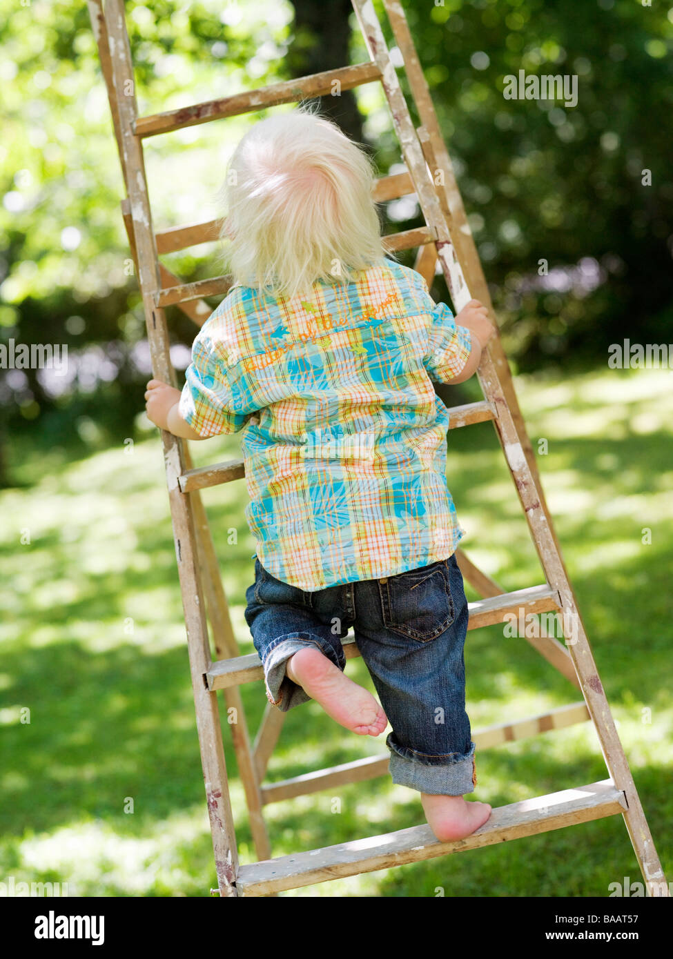 A boy climbing a ladder, Stockholm, Sweden Stock Photo - Alamy