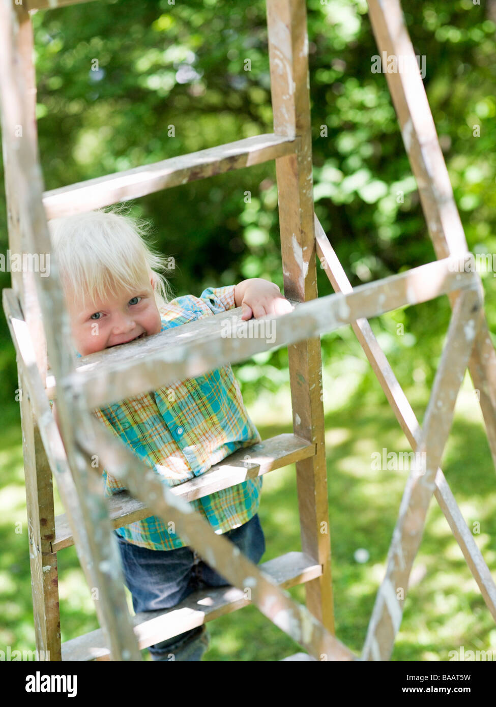 A boy climbing a ladder, Stockholm, Sweden Stock Photo - Alamy