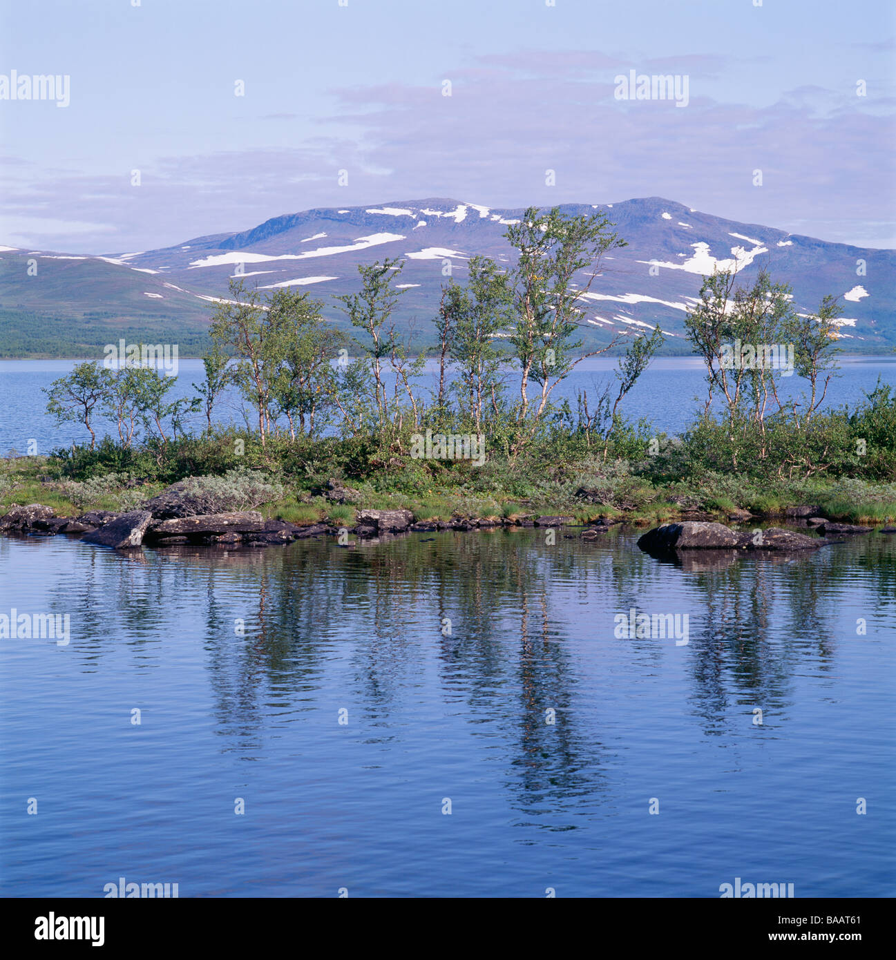 Island in river with mountains in background Stock Photo - Alamy
