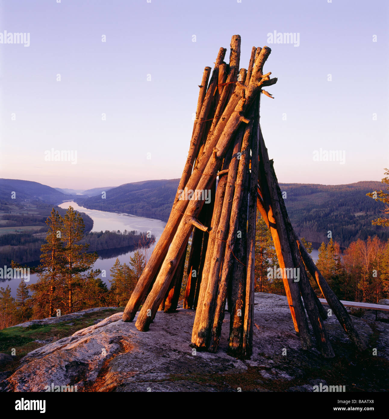 Logs arranged on rock Stock Photo - Alamy