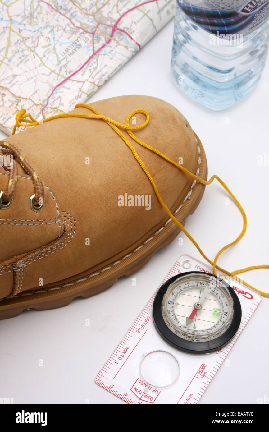 walking boot compass and map Stock Photo - Alamy