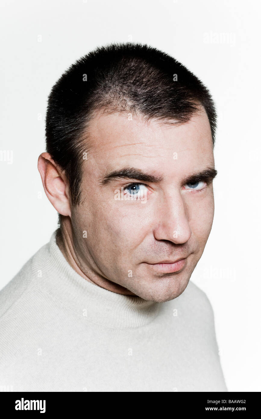 Portrait of an handsome expressive man in studio on white isolated ...