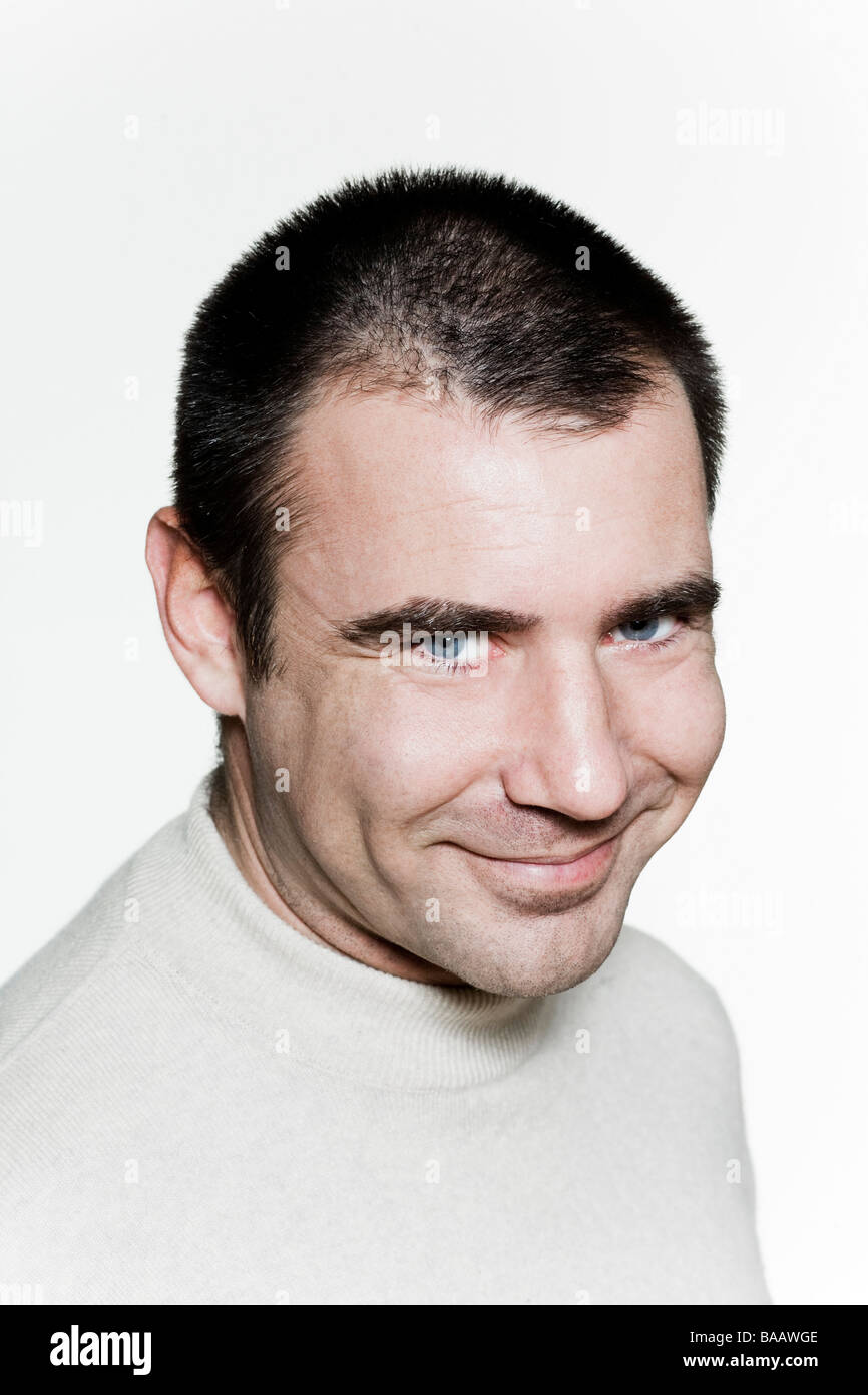 Portrait of an handsome expressive man in studio on white isolated ...