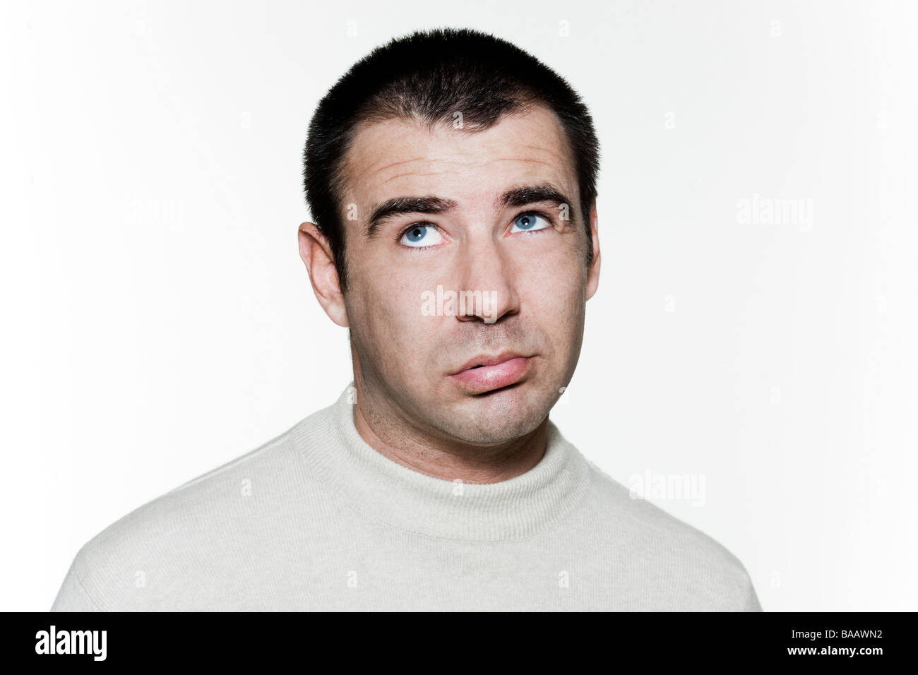 Portrait of an handsome expressive man in studio on white isolated ...