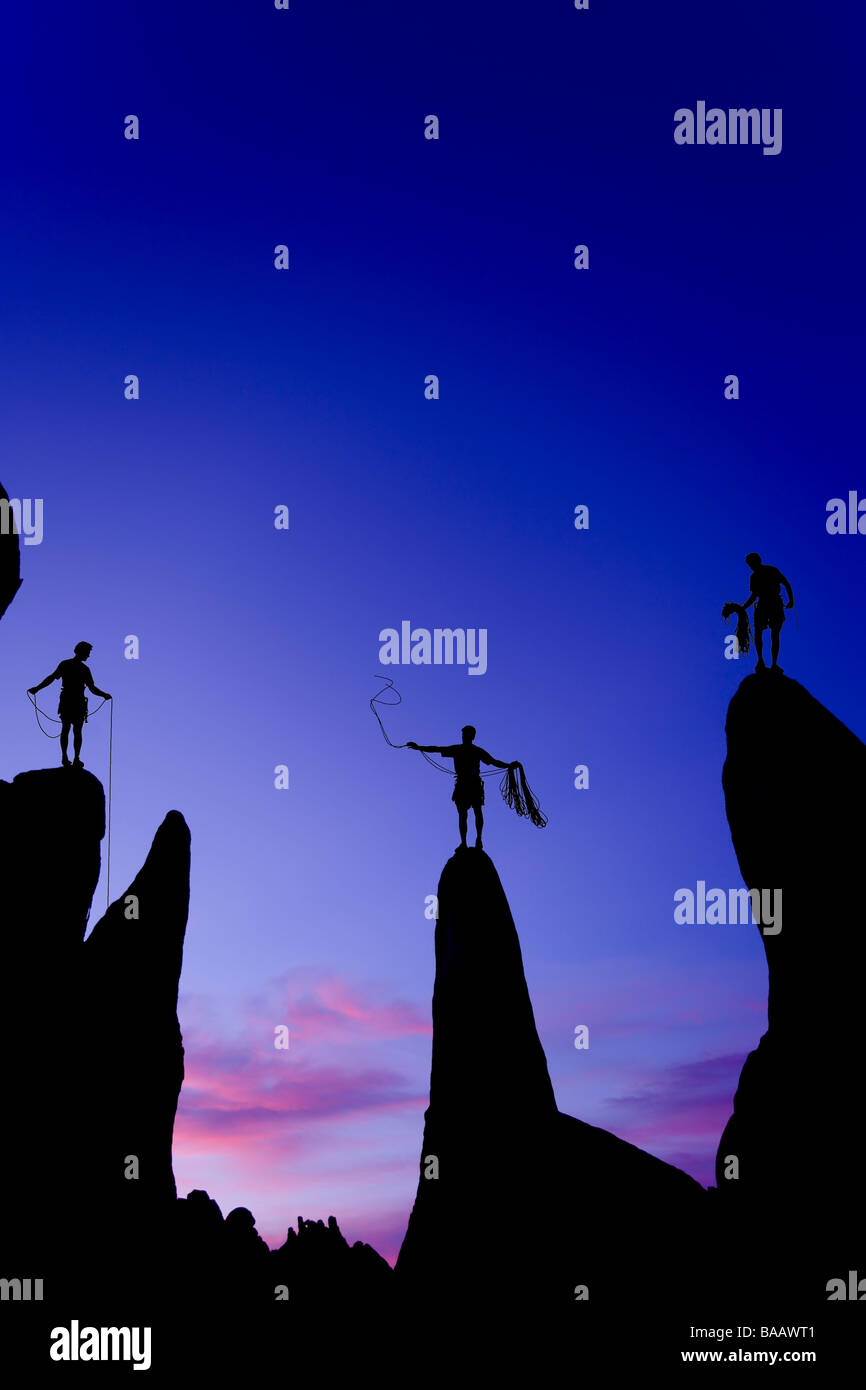 Team of rock climbers reaching the summit Stock Photo - Alamy