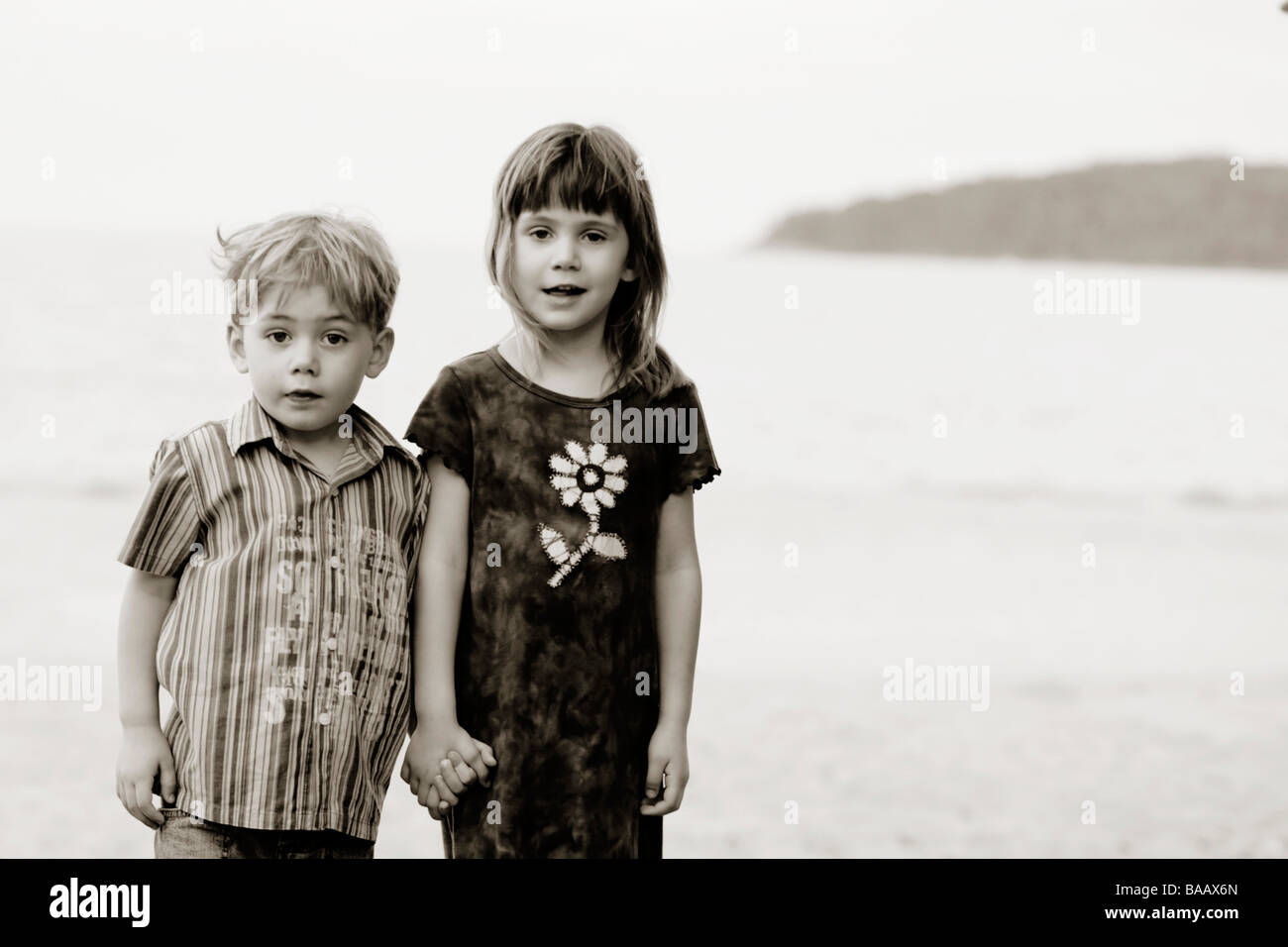 Two Scandinavian children holding eachothers hands, Brazil Stock Photo ...
