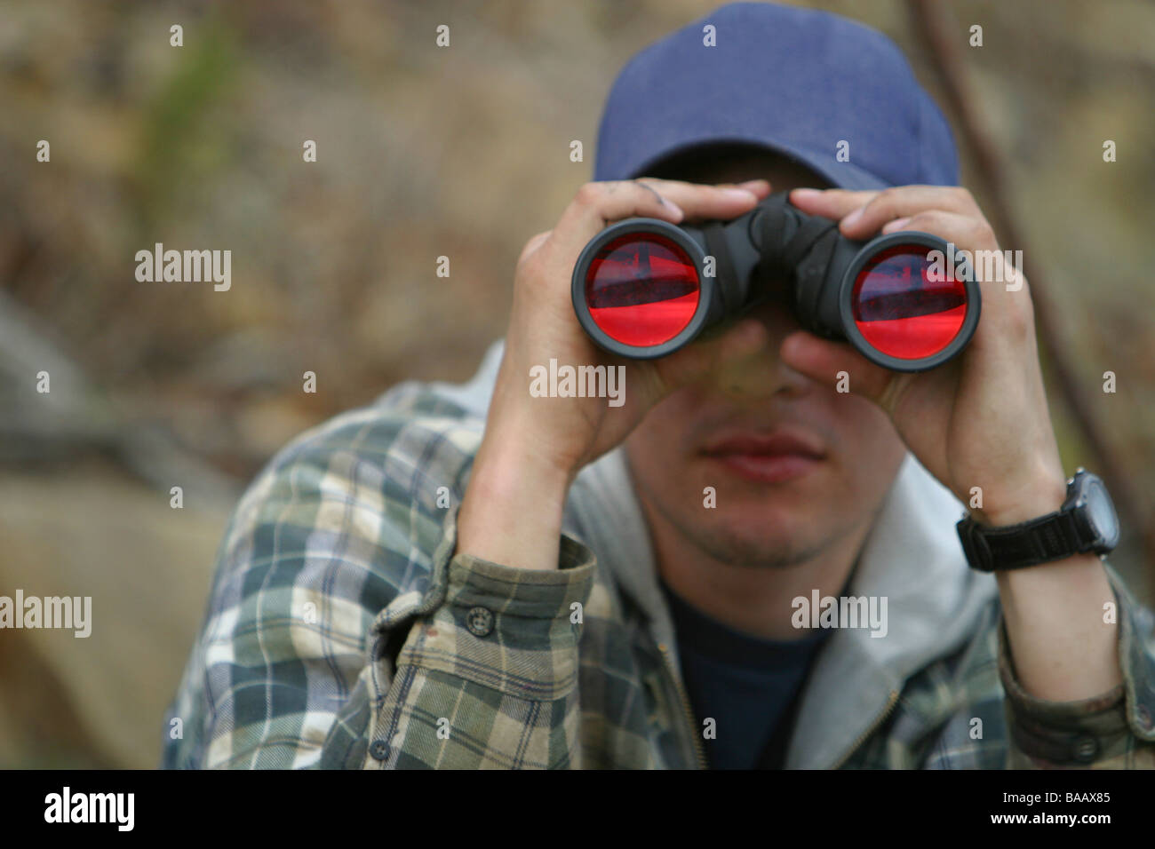 A First Nations hunter looks for Porcupine caribou on the banks of the ...