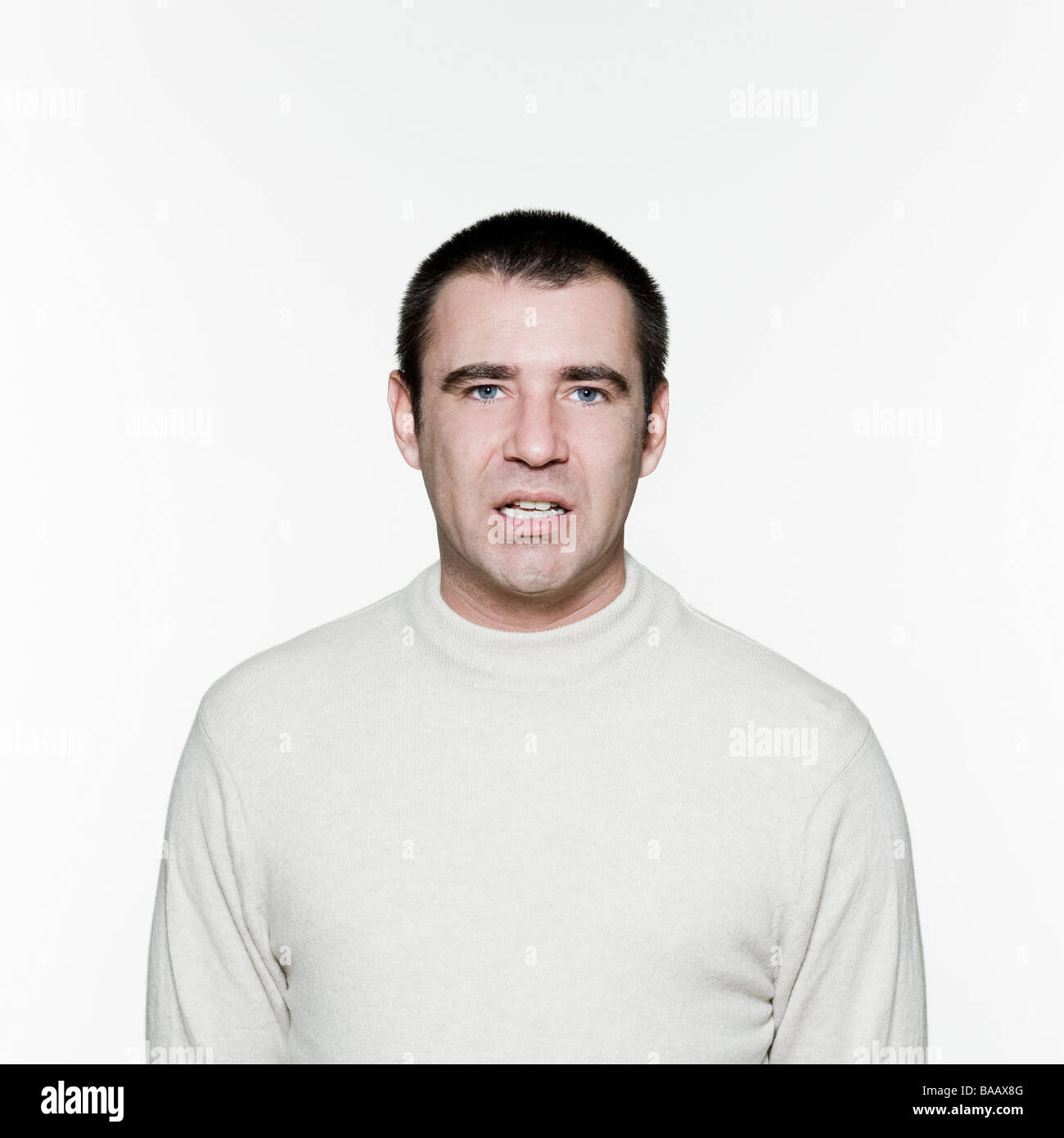 Portrait of an handsome expressive man in studio on white isolated ...