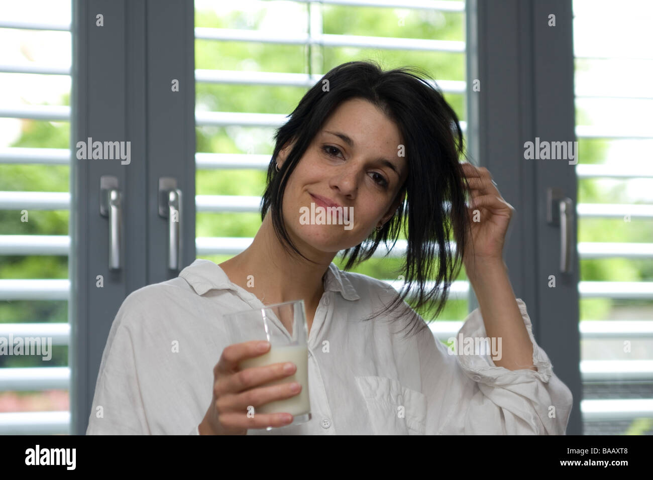 Young woman with a glass of milk - Junge Frau mit einem Glas Milch ...