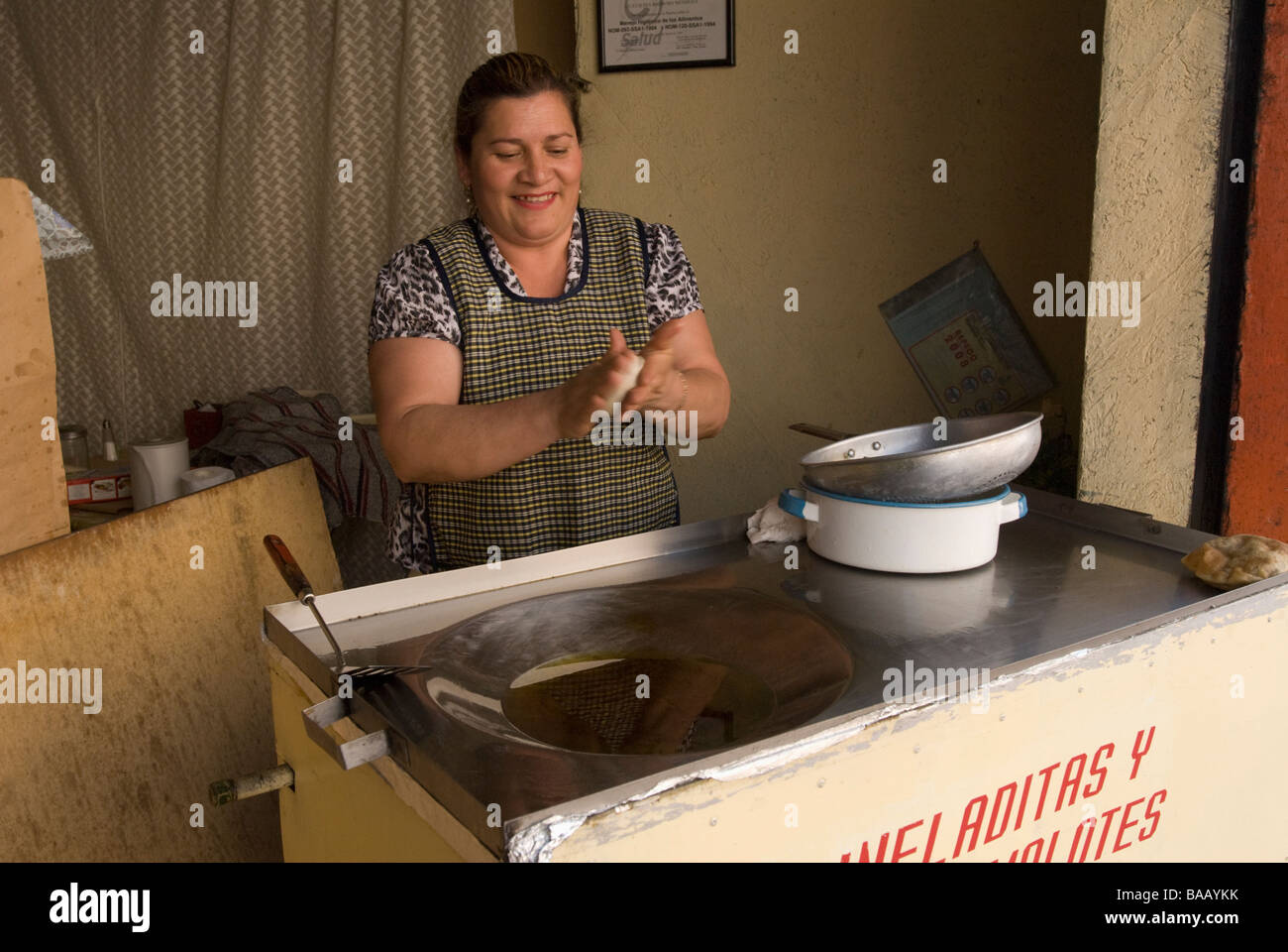 Mexican lady cooking tortilla hi-res stock photography and images - Alamy