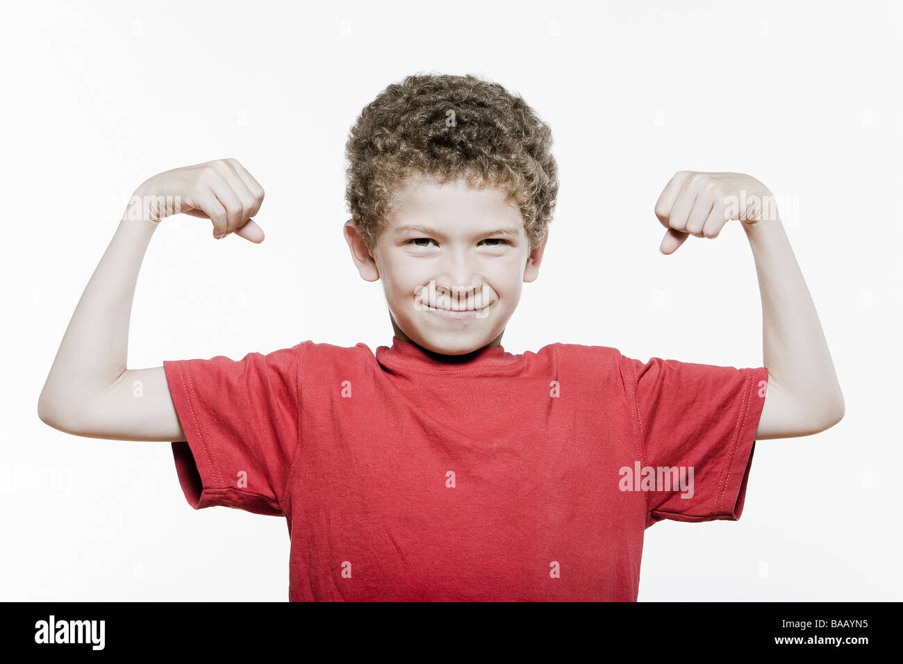 little caucasian strong boy portrait flexing muscle biceps mischief ...
