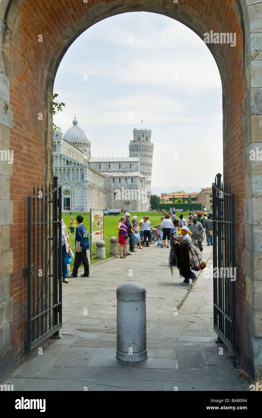 photograph of arched entrance to leaning tower of Pisa and piazza del ...