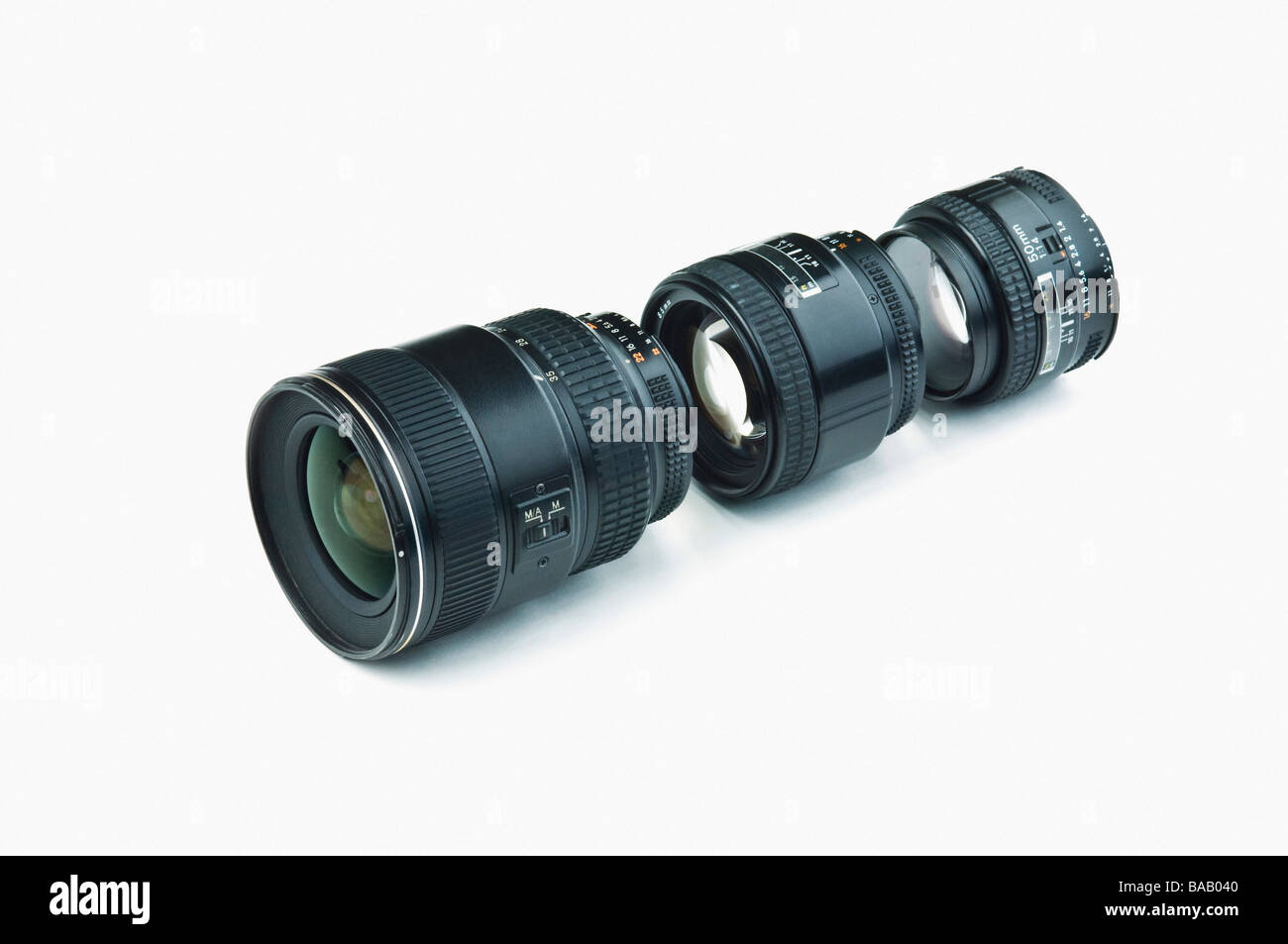 Three photographic lenses in a row Stock Photo - Alamy