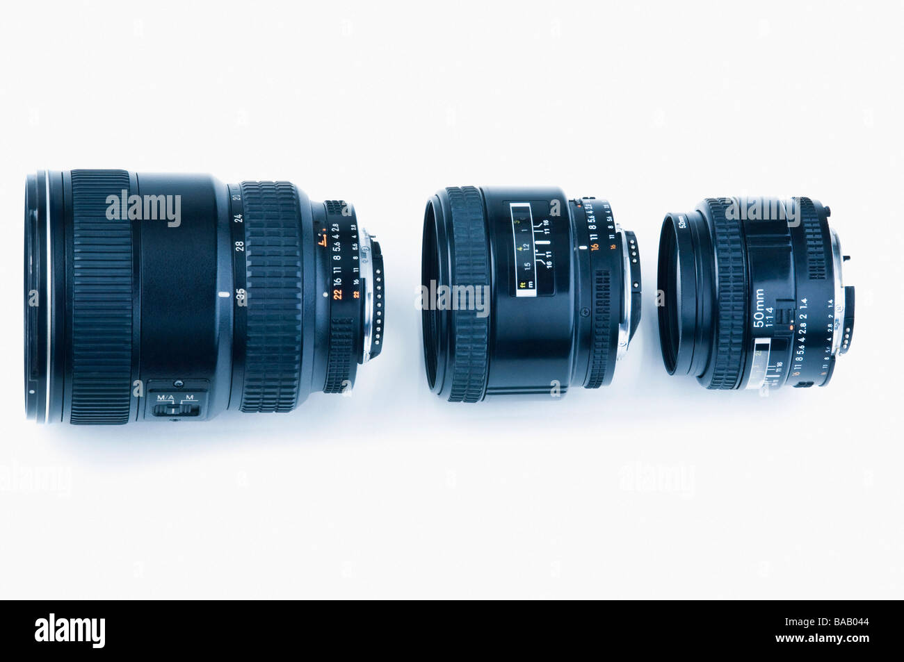 Three photographic lenses in a row Stock Photo - Alamy