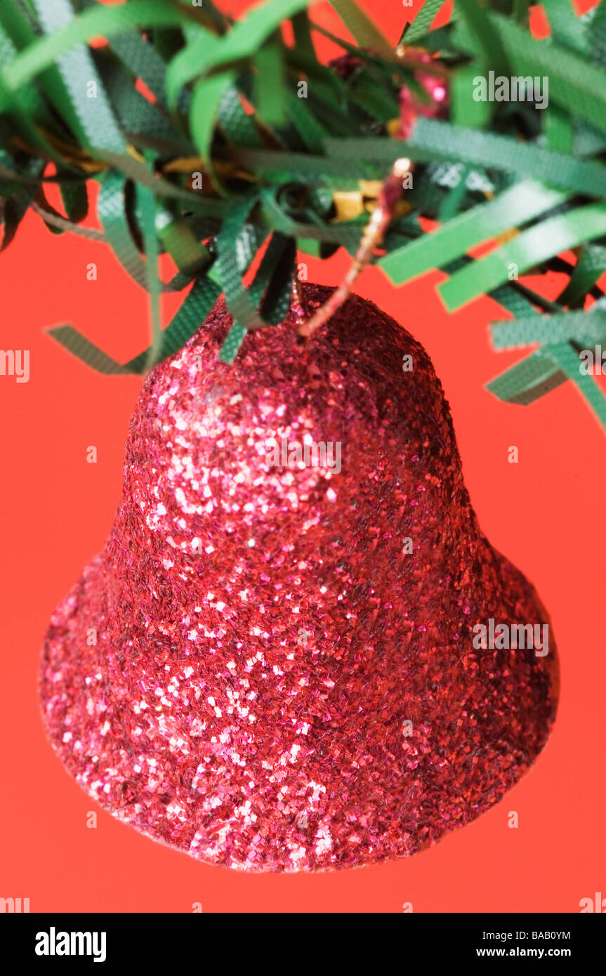 Red Christmas bell hanging on a Christmas tree Stock Photo - Alamy