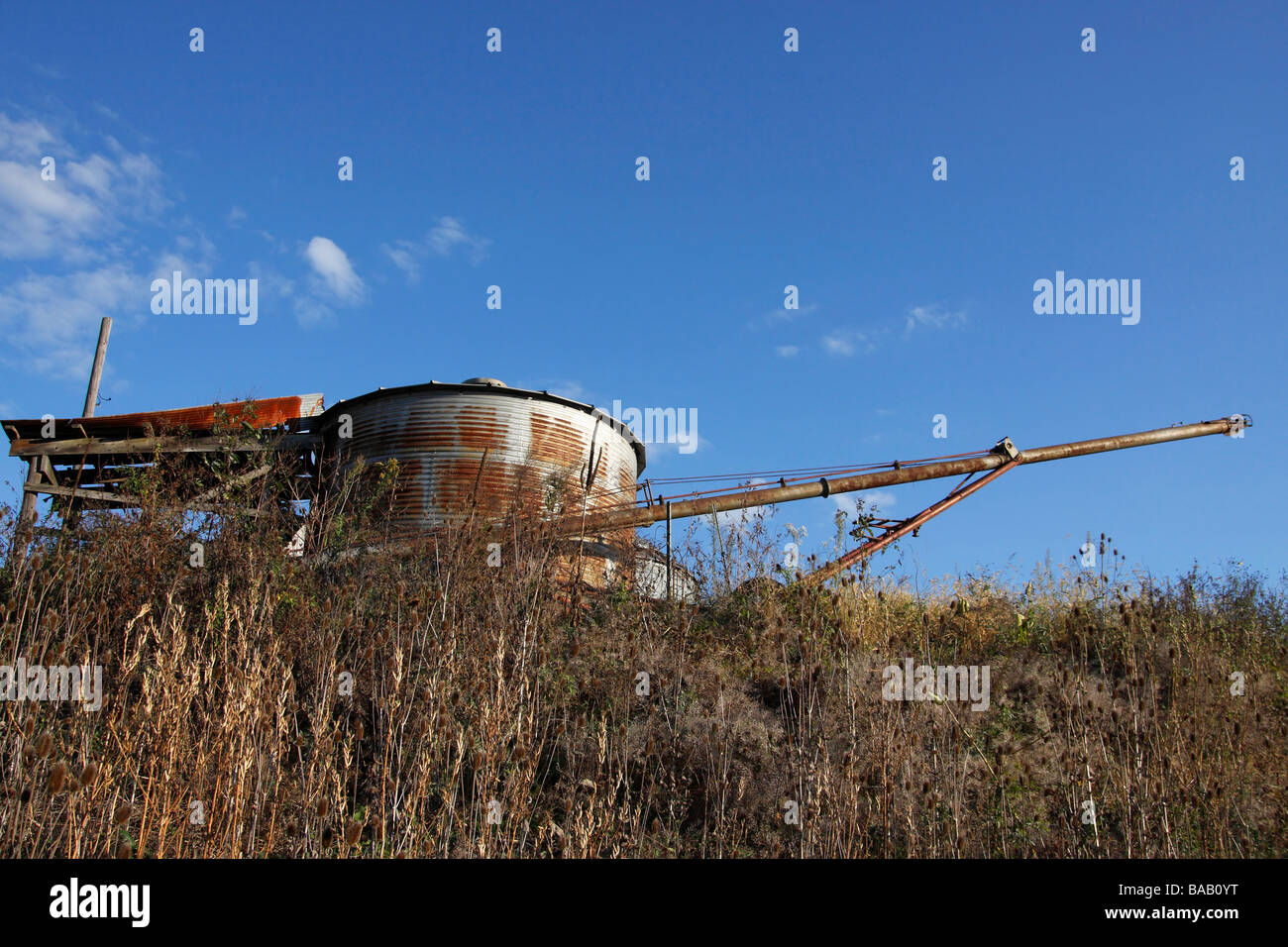Abandoned field with rusty silo in USA hi-res low angle for below ...