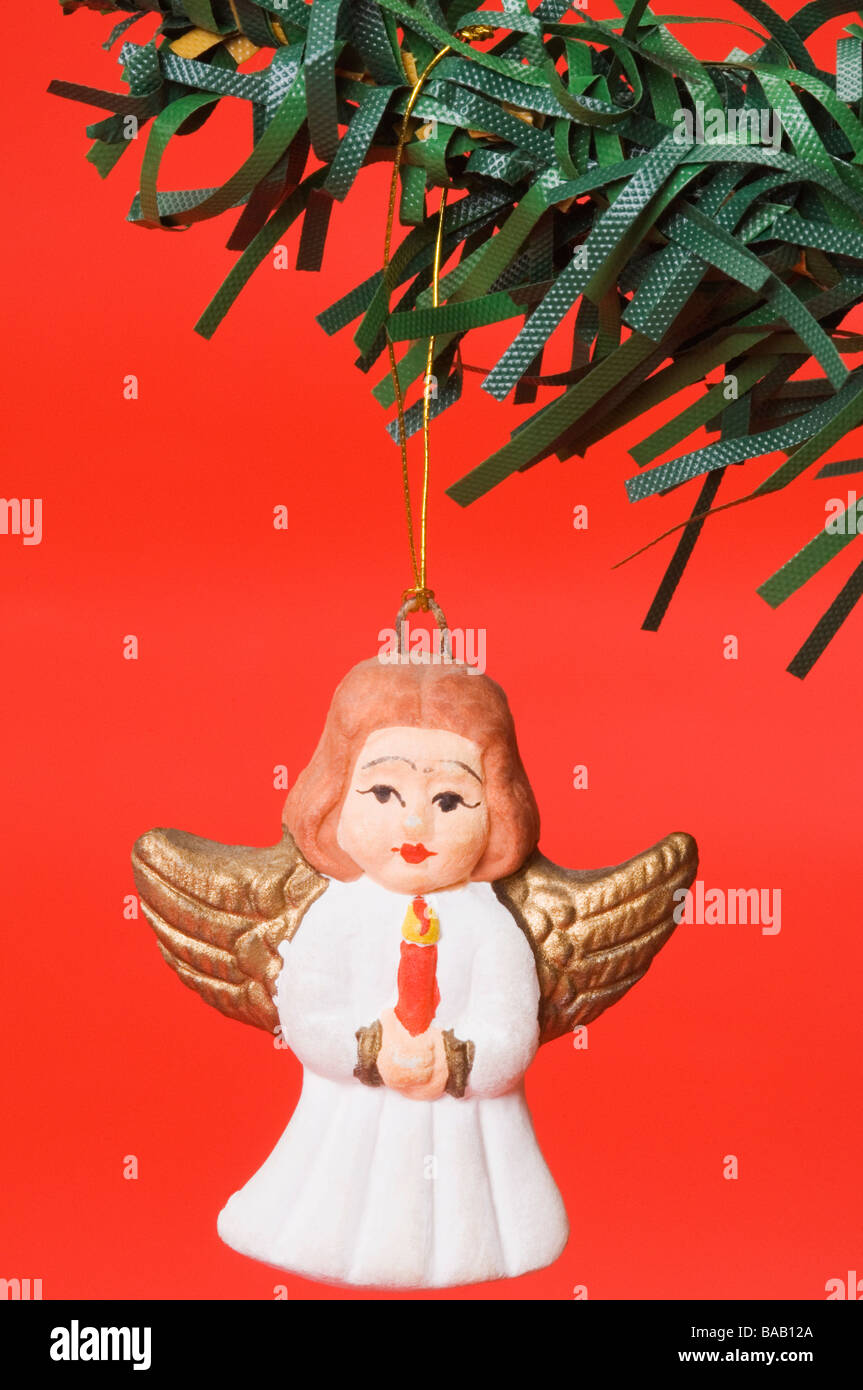 Christmas angel figurine hanging on a Christmas tree Stock Photo - Alamy