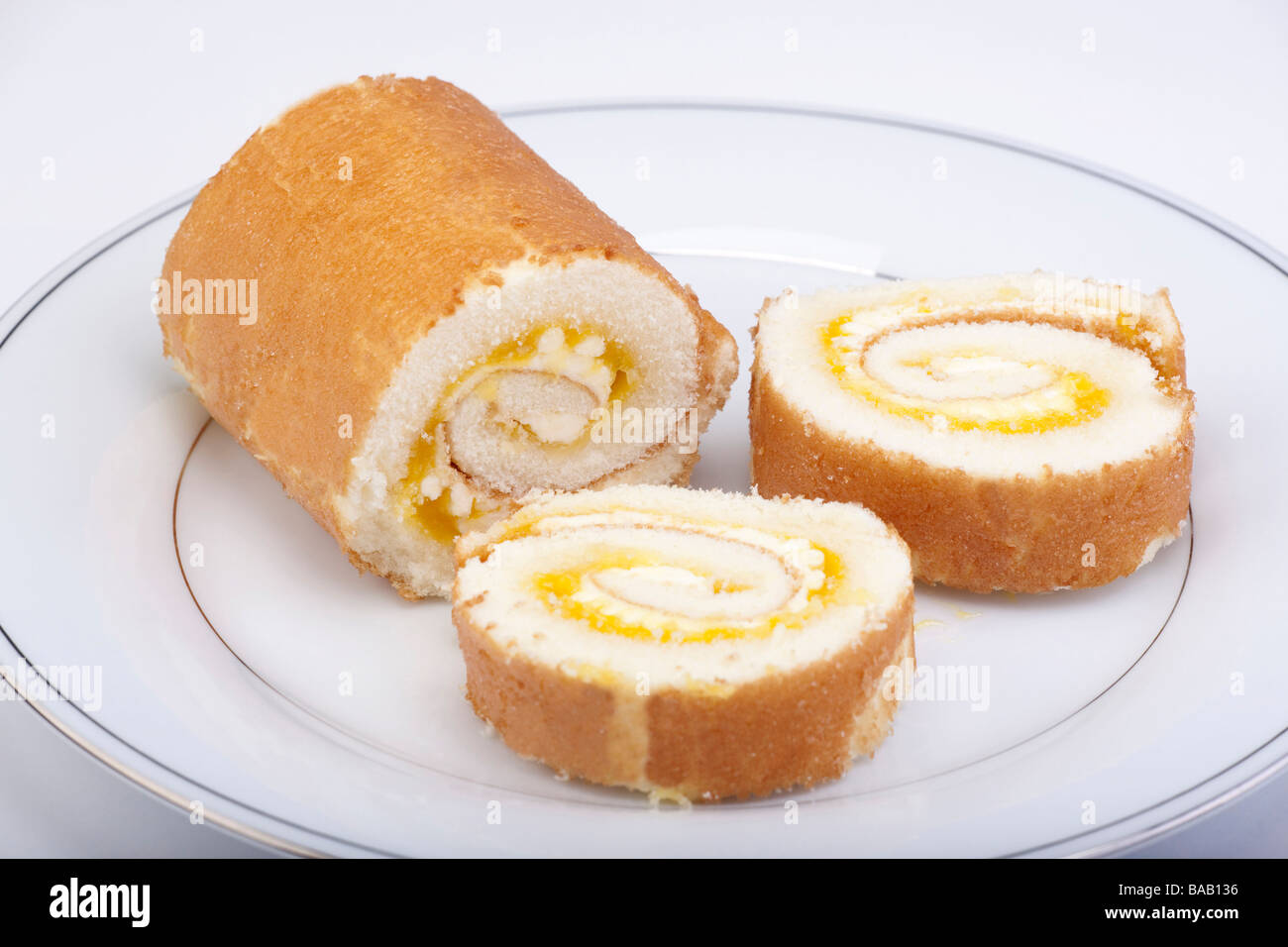 lemon swiss roll slices Stock Photo - Alamy