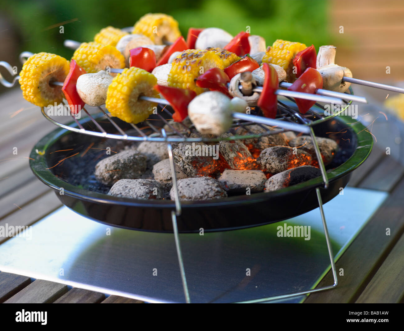 Skewers on a table grill, Sweden Stock Photo - Alamy