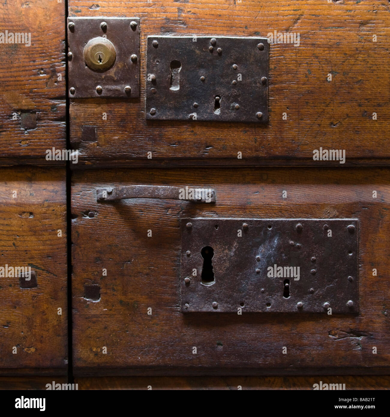 Worn & riveted locks adorn a well used doorway in Siena, Tuscany, Italy ...
